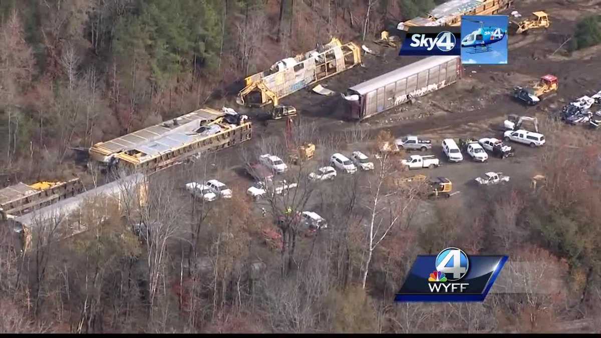 Crews are cleaning up after a train crash leaves hundreds of vehicles ...