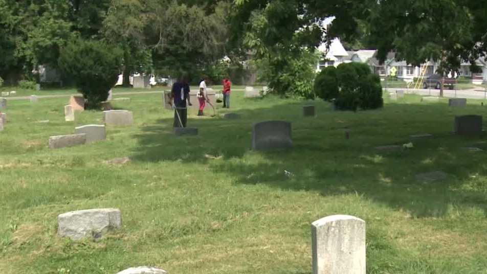 Community members are working together to clean up a cemetery