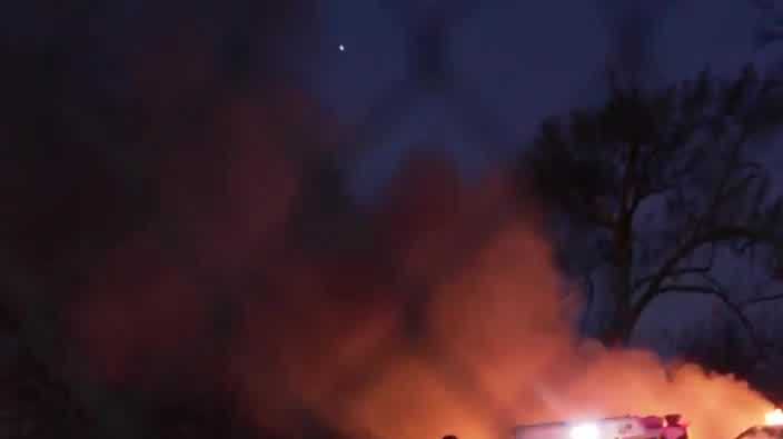 Crews respond to fire at a trailer in north Omaha on Friday