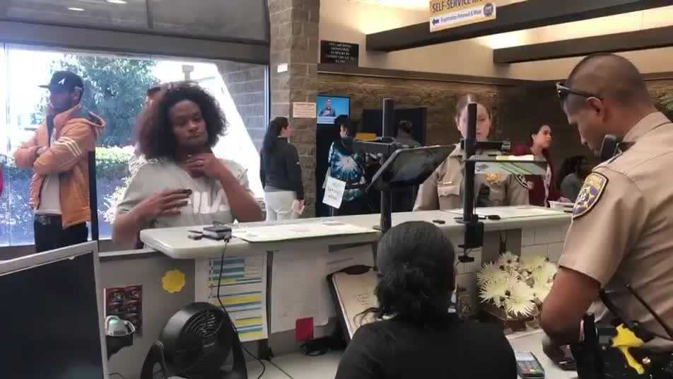 CHP officer uses sign language, digs into own pocket to help woman get ID