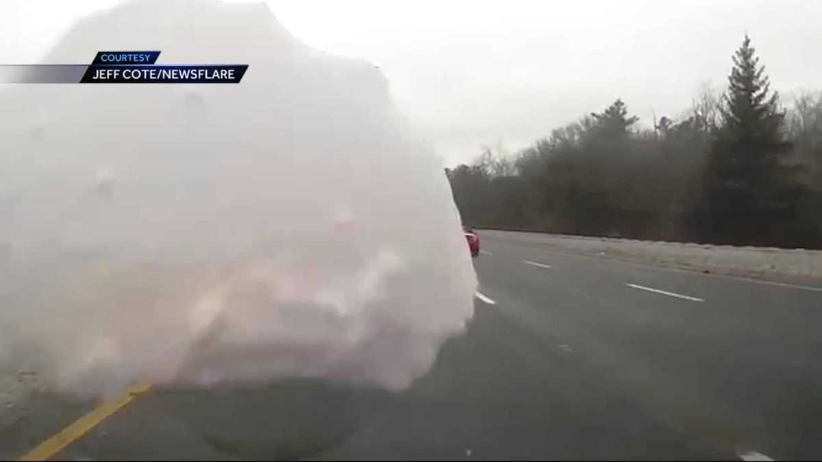 Dashcam captures ice shatter windshield on highway