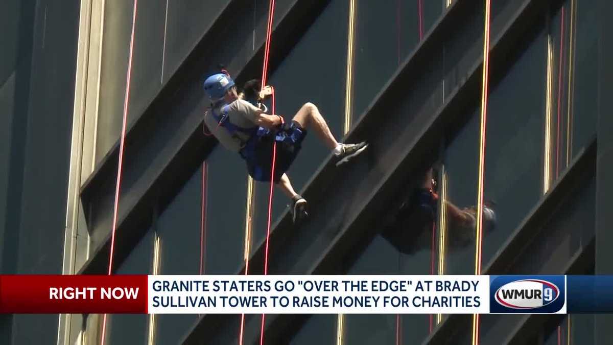 Climbers rappel down Manchester's tallest building for good cause