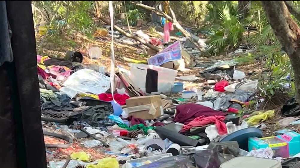 Trash piling up at large transient camp in Titusville