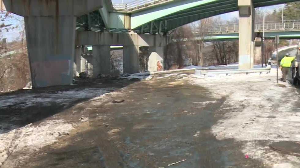 Crews clean up Manchester homeless camp after fire department clears site