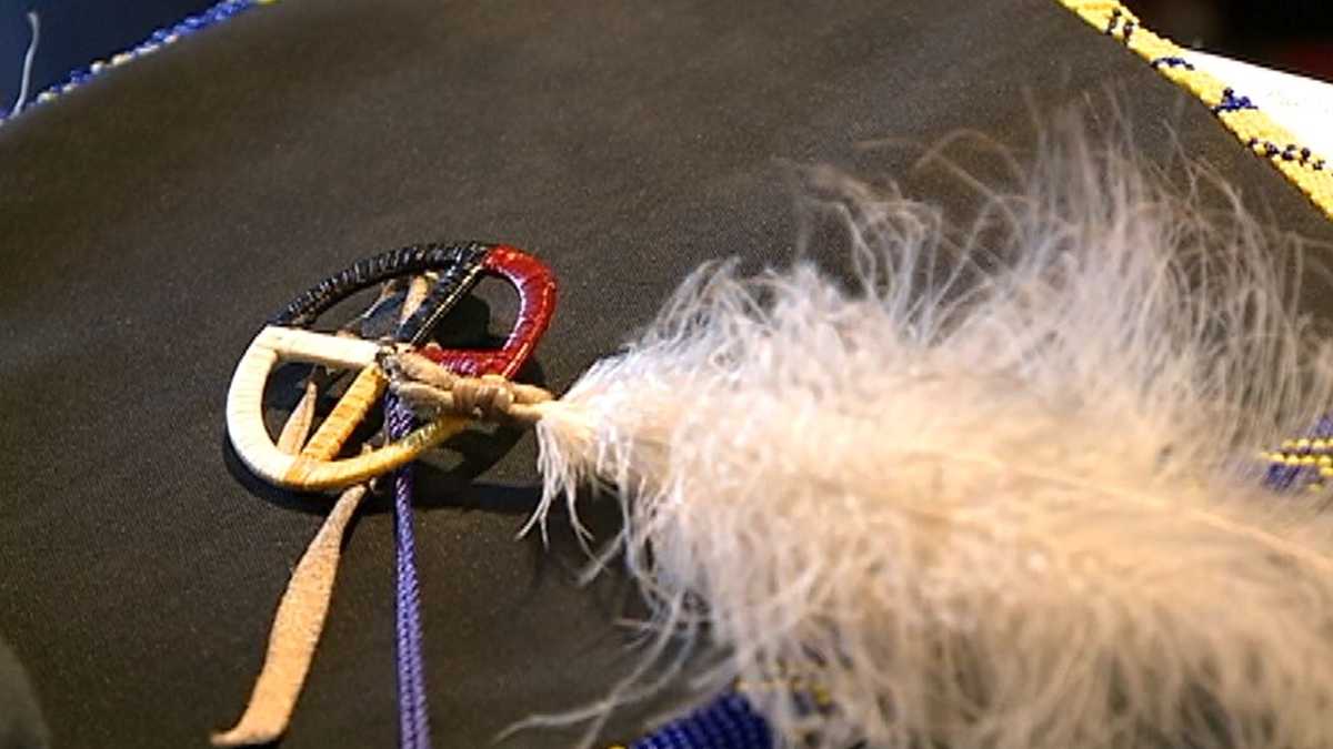 Omaha South student allowed to wear plume in cap for graduation