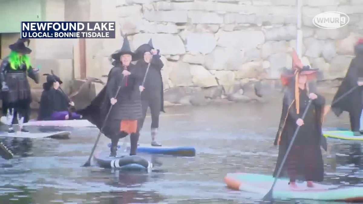 Group of 'witches' paddleboard on Newfound Lake