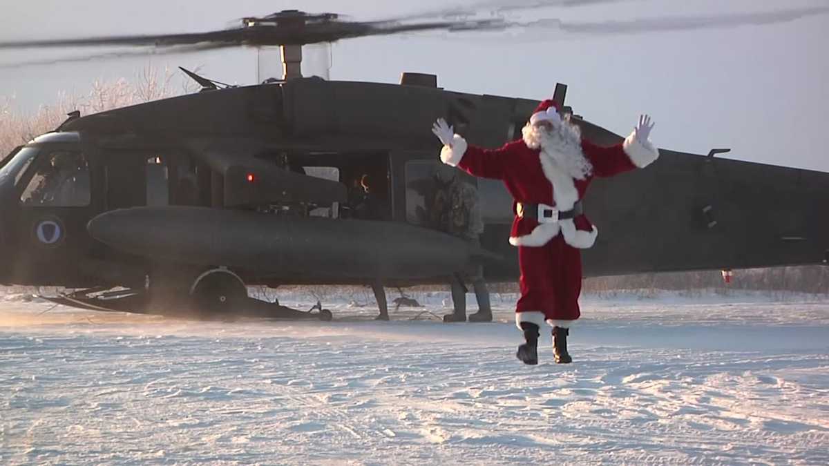Santa, soldiers bring joy to a town that's falling into a river