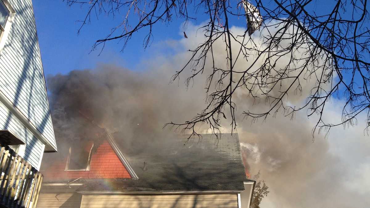 Firefighters evacuate burning home in Lawrence