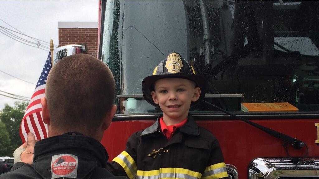 Young boy with brain tumor named honorary firefighter