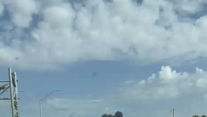 Plane and car engulfed in flames after deadly crash in Boca Raton