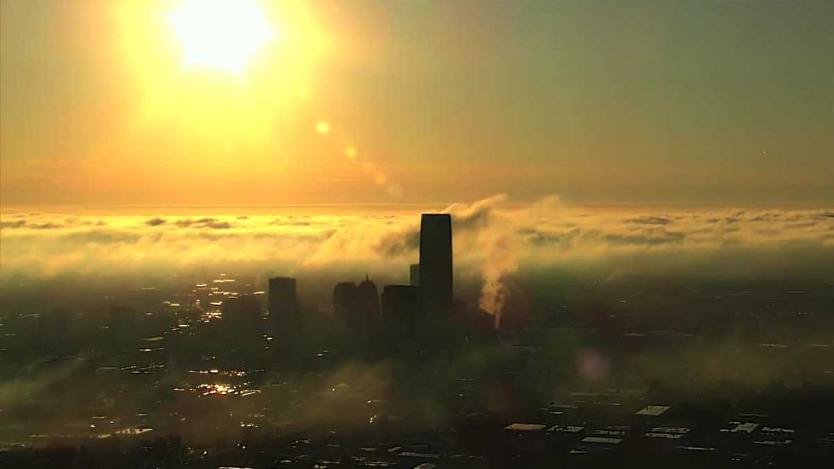 Beautiful Oklahoma sunrise captured amid low clouds in OKC