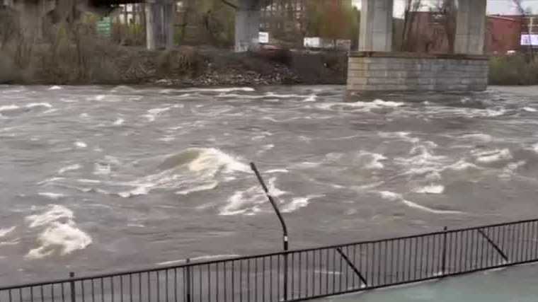 Merrimack River rises, reaches steps at park in Manchester, NH