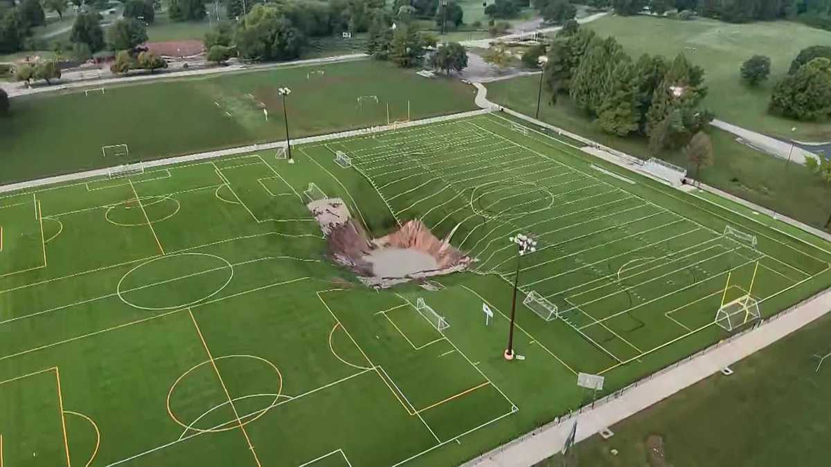Massive sinkhole continues to grow after swallowing part of soccer ...