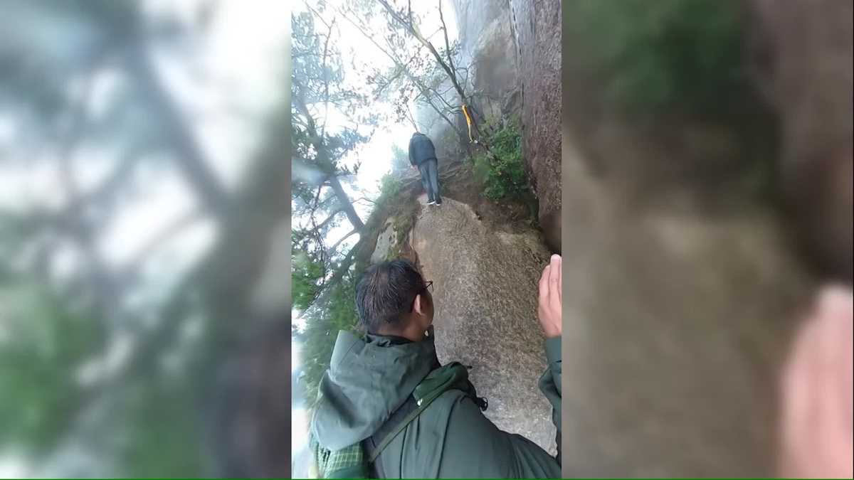 Hiker lucky to be alive after camera captures terrifying moment of ...
