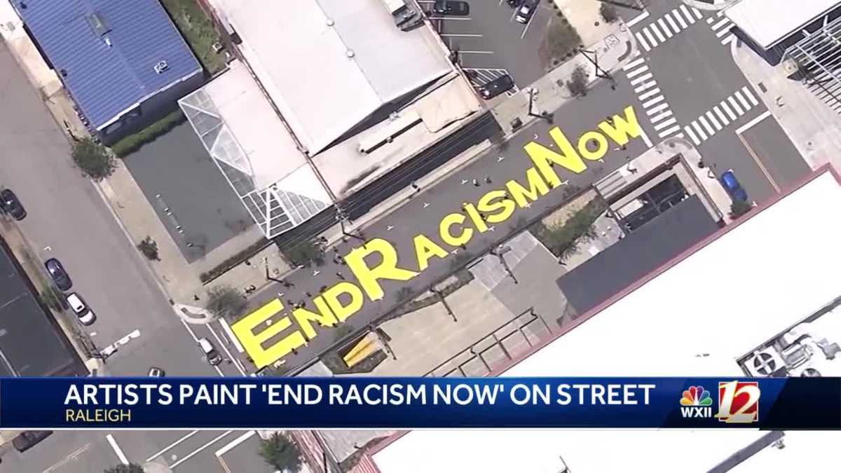 “End Racism Now”printed in large yellow letters adorns N.C. street