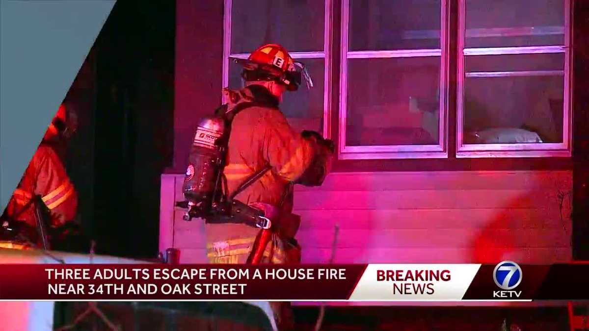 1 woman suffers minor burns in house fire, 3 escape safely