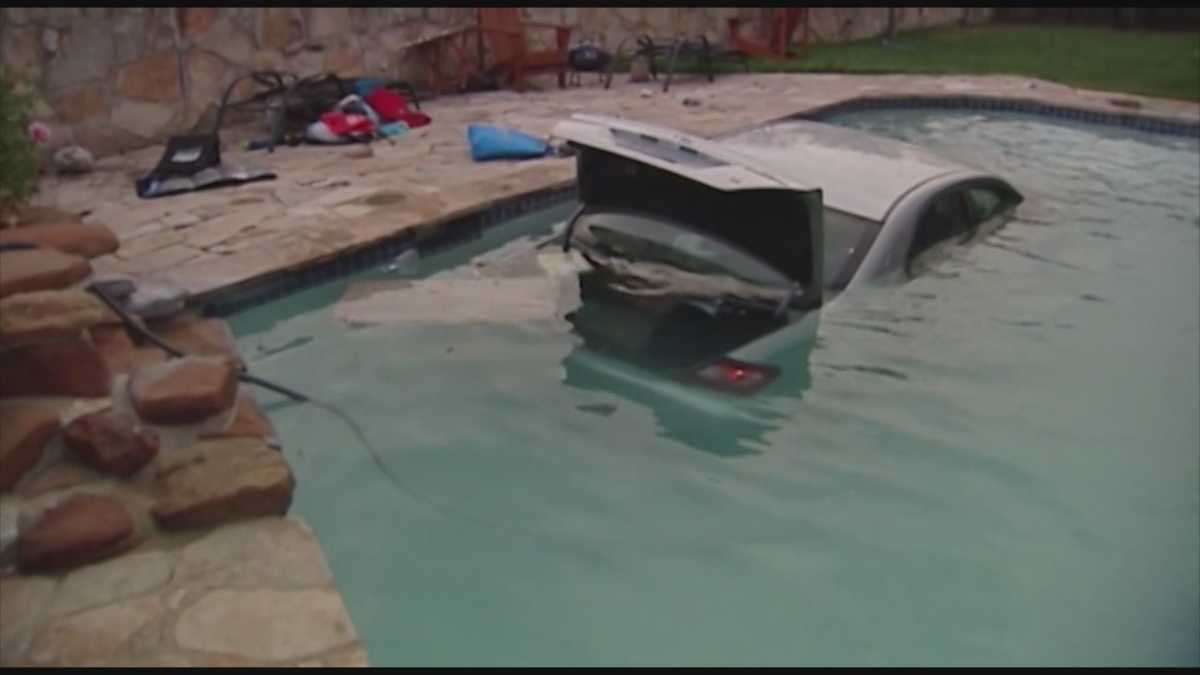 Car crashes through wall, plunges into pool