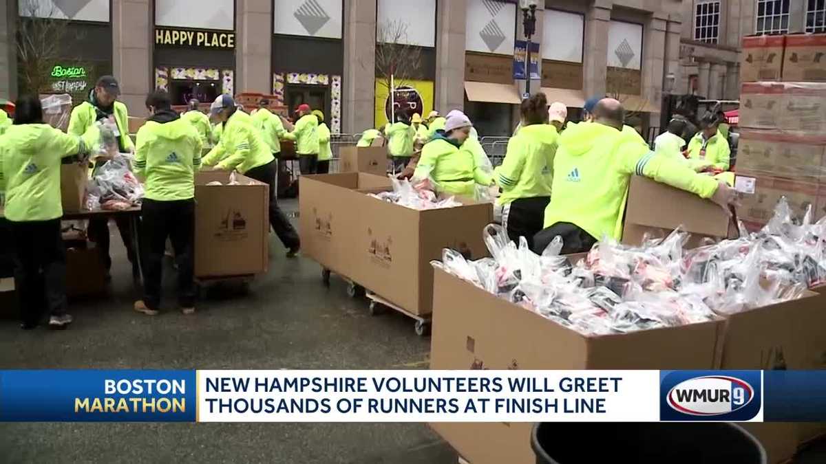 Volunteers work along Boston Marathon route