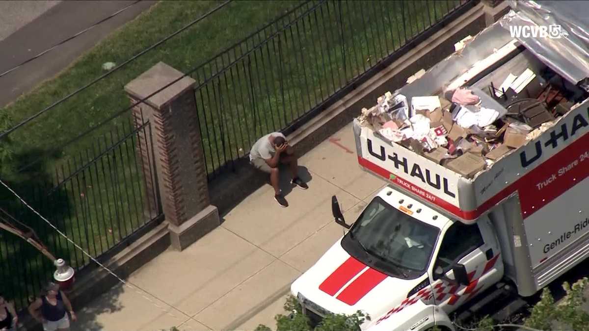 Moving truck 'Storrowed' by bridge in Boston