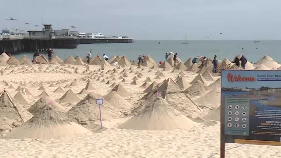 Father-son duo build hundreds of pyramids on a Santa Cruz beach