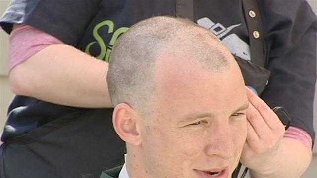 Firefighters shave their heads for cancer