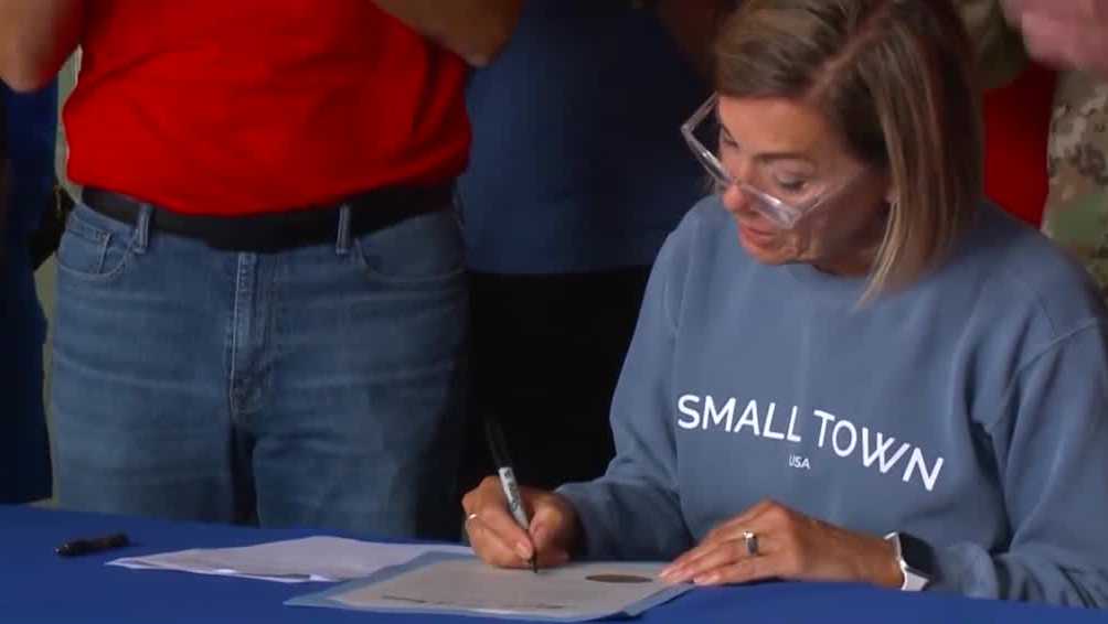Governor Reynolds signs two proclamations at the Iowa State Fair