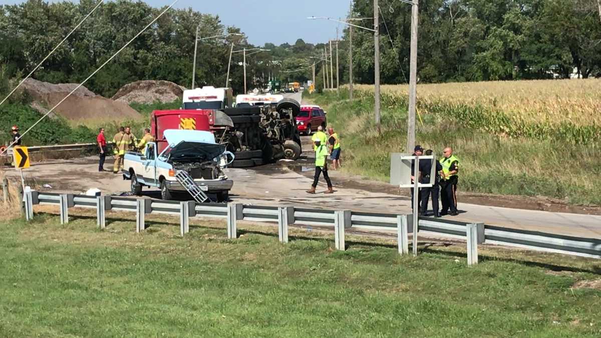 1 seriously injured when garbage truck tipped over onto pickup truck ...