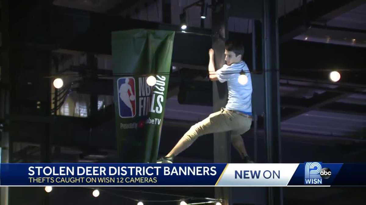 Fans climb support beams, steal NBA Finals banners after Bucks win