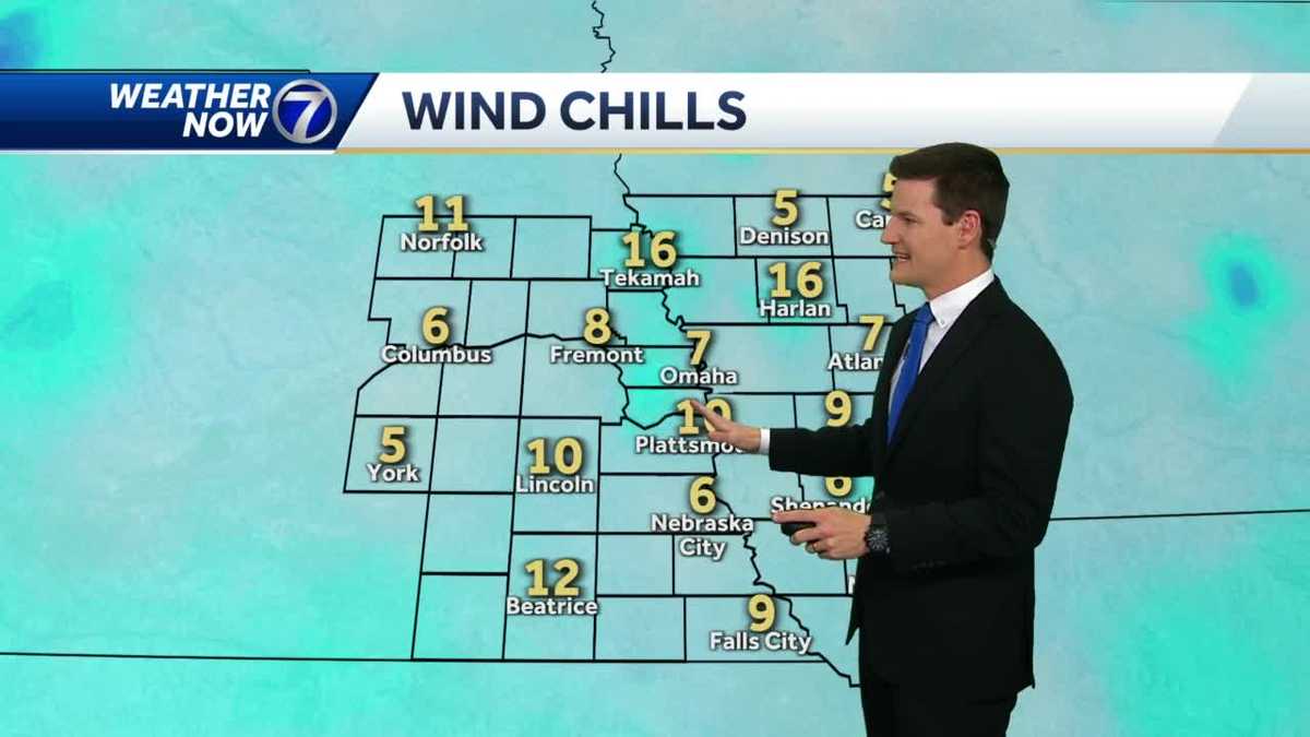 Cold Tuesday morning, light snow west