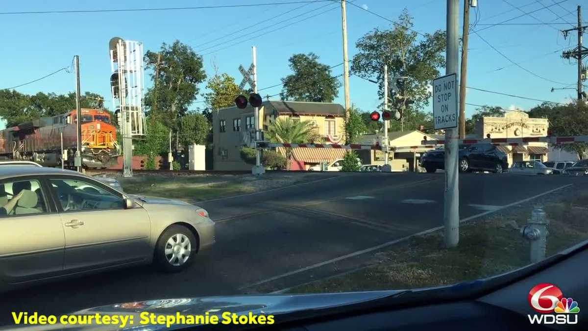 CLOSE CALL: Train nearly hits car stuck on tracks in Old Metairie