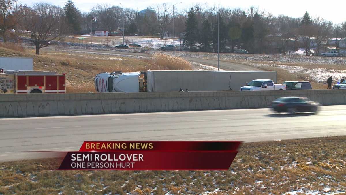Semi flips over, slides across interstate