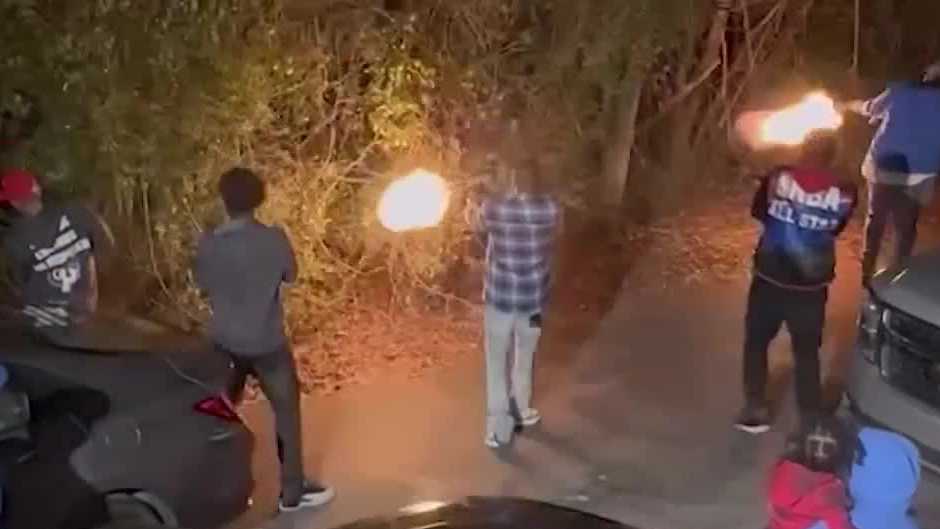Alabama video shows celebratory gunfire toward road with toddler