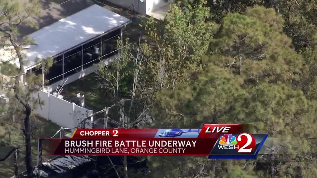 Crews battle brush fire near Orange County homes