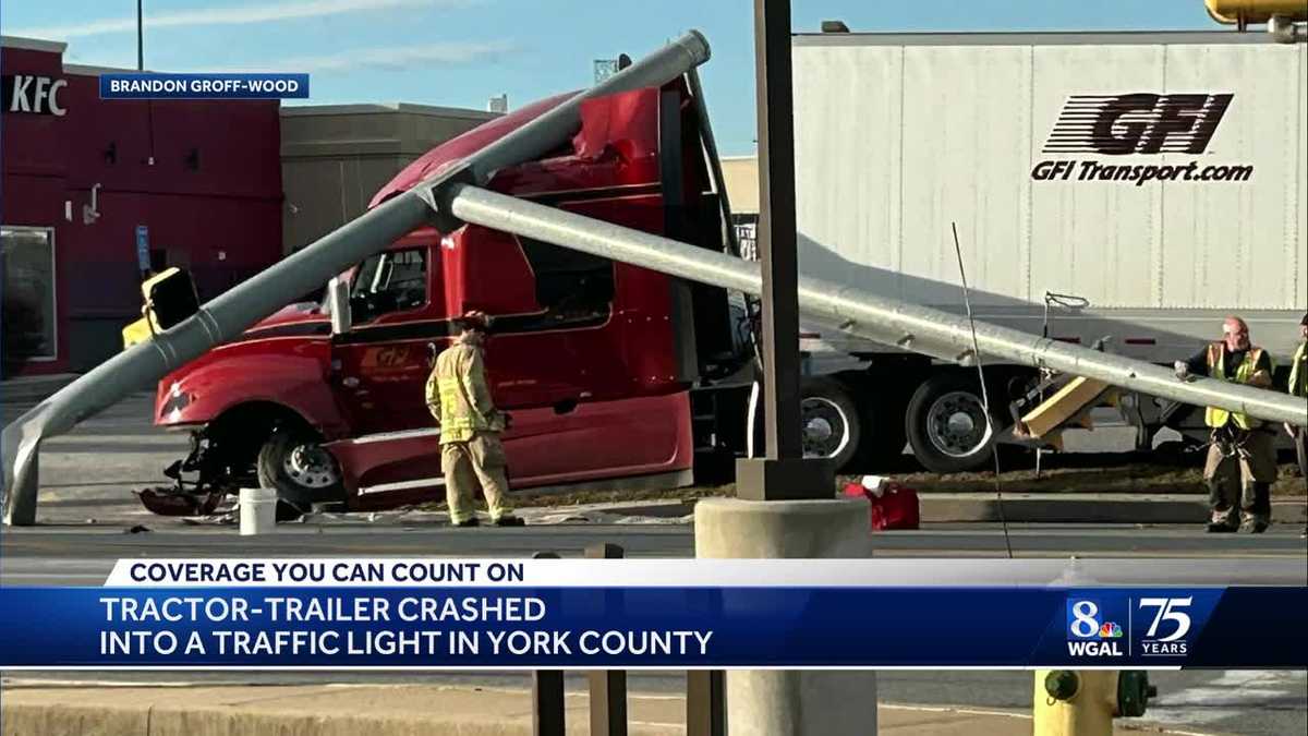 Intersection closed after tractor-trailer crashes into traffic light in ...