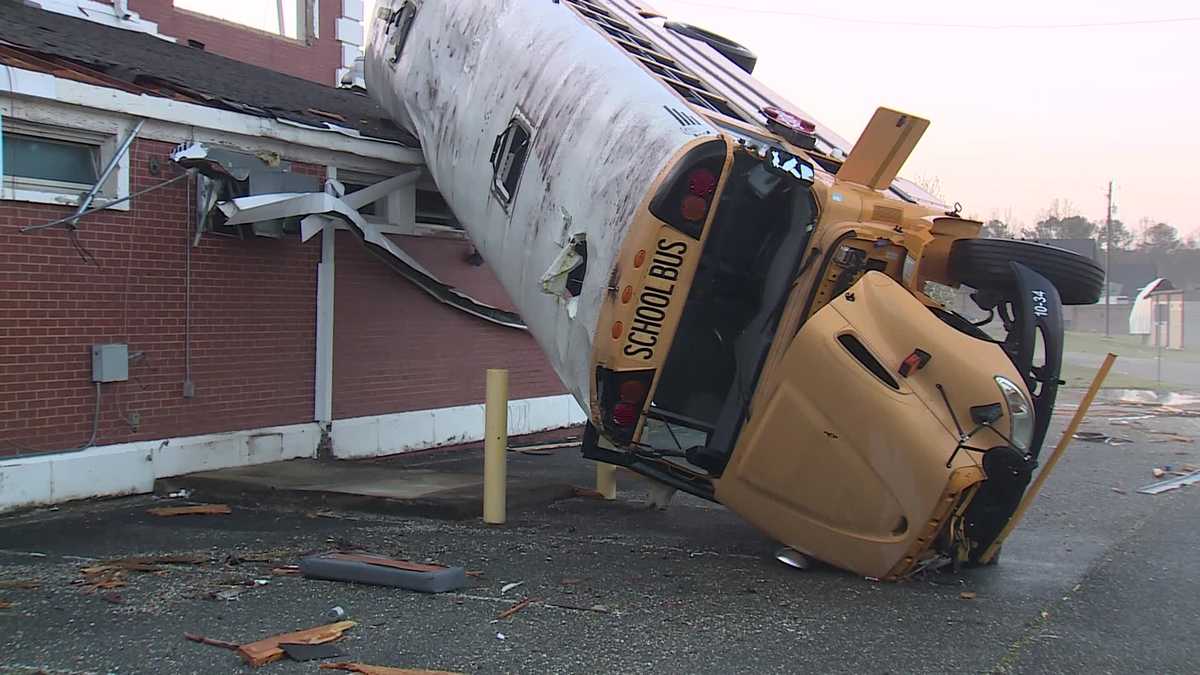 Alabama tornado damage: Bus on roof of school