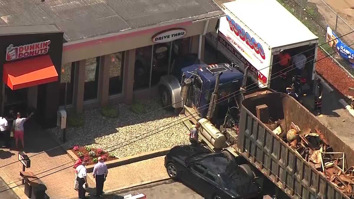 Tractor-trailer crashes into Dunkin' Donuts