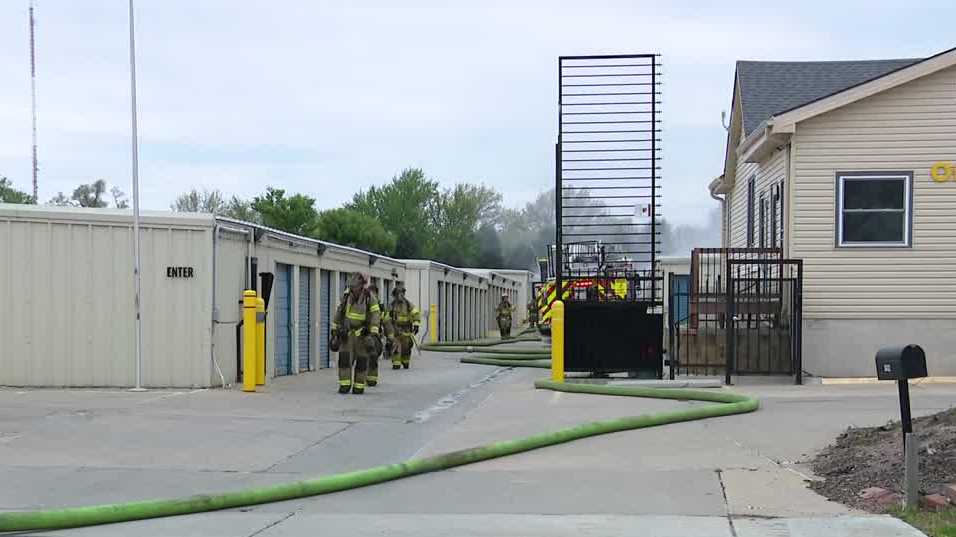 Car catches fire inside storage unit, firefighters work to extinguish ...