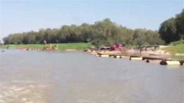 Dredge ship works to dig out canal