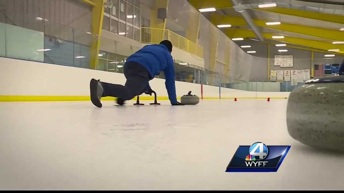 WYFF News 4's Nigel Robertson tries out curling