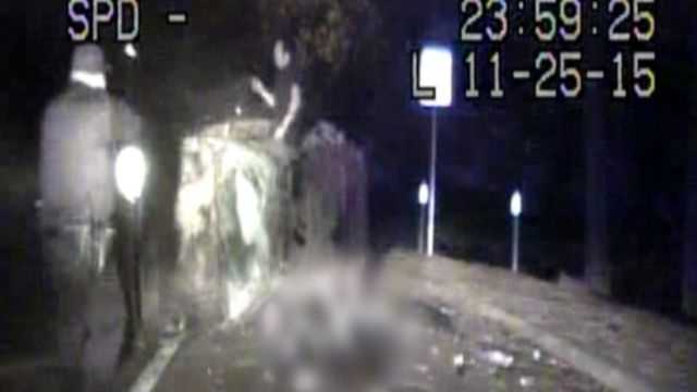 Officer shoots suspect crawling from wreckage; Shooting ruled accidental