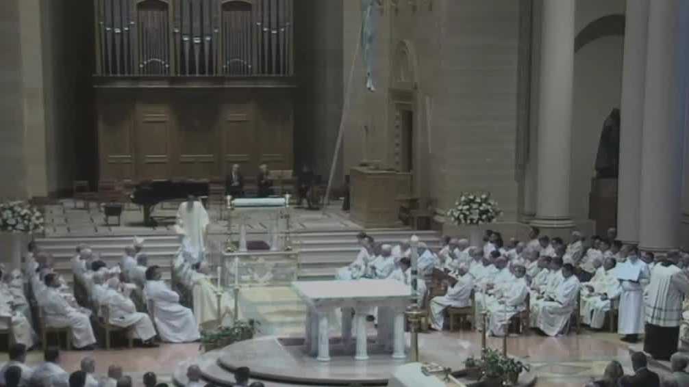 Funeral Mass for former Milwaukee archbishop draws supporters, protesters
