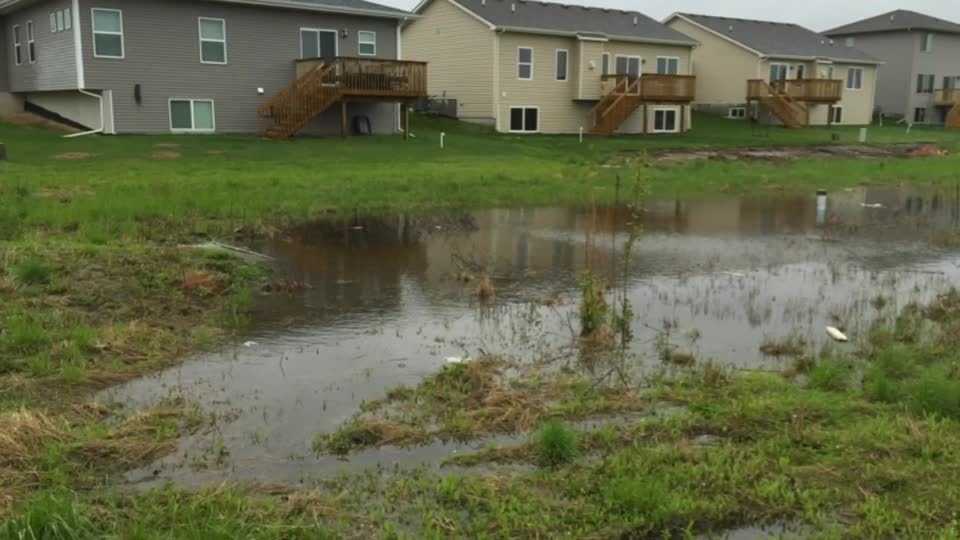 Homeowners upset by backyard standing water problem