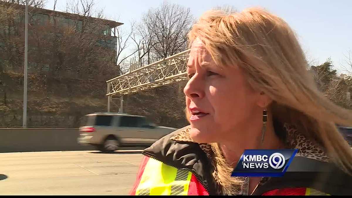 Car narrowly misses hitting KDOT spokeswoman, news photographer