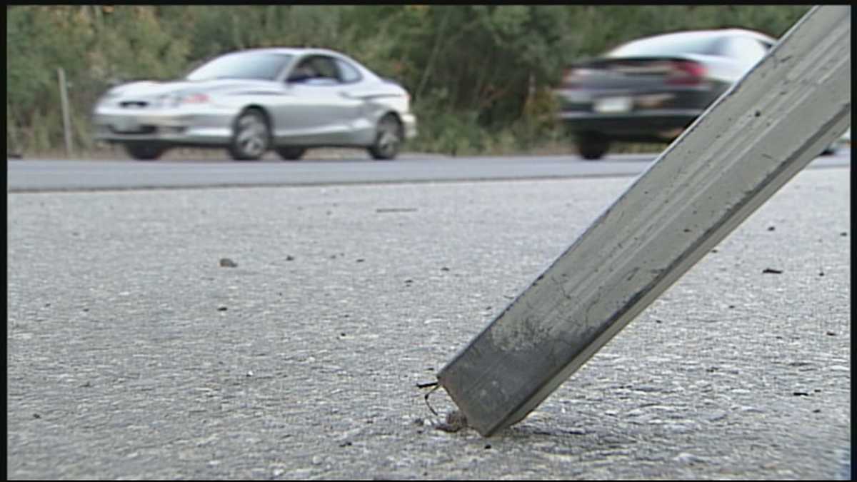 Flying road sign injures woman
