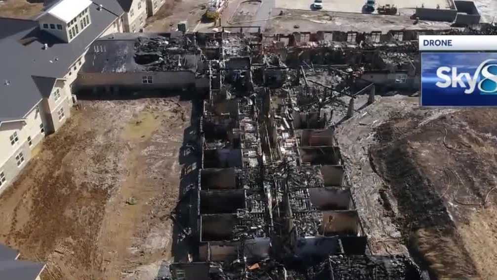 Fire officials say bystanders at massive blaze made access difficult