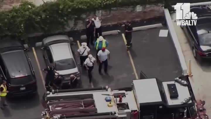 Fire truck stuck after parking garage collapses