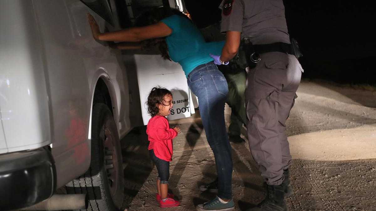 The story behind the heartbreaking viral photo of girl crying at border