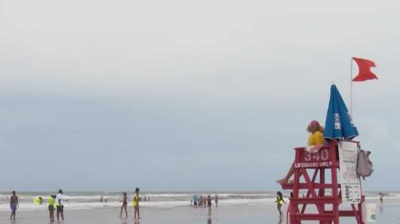 Officials urge people to maintain social distancing at the beach