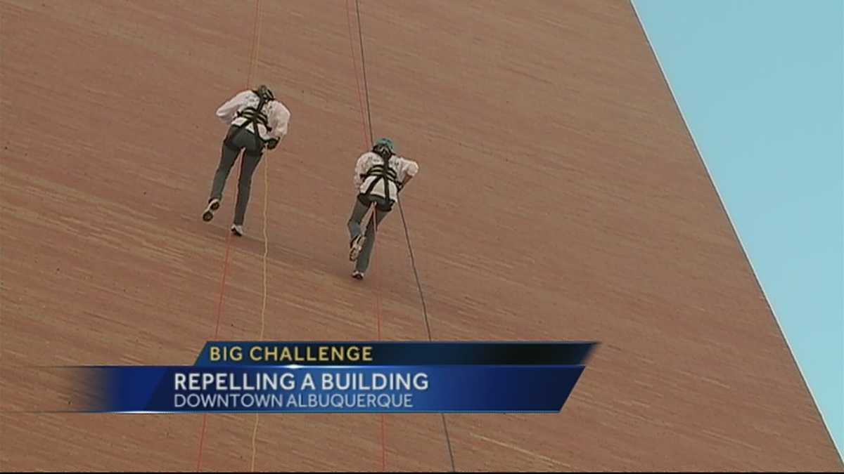 Special Olympics fundraisers repel down bank building