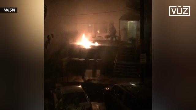 Restaurant workers help to extinguish massive fire next door